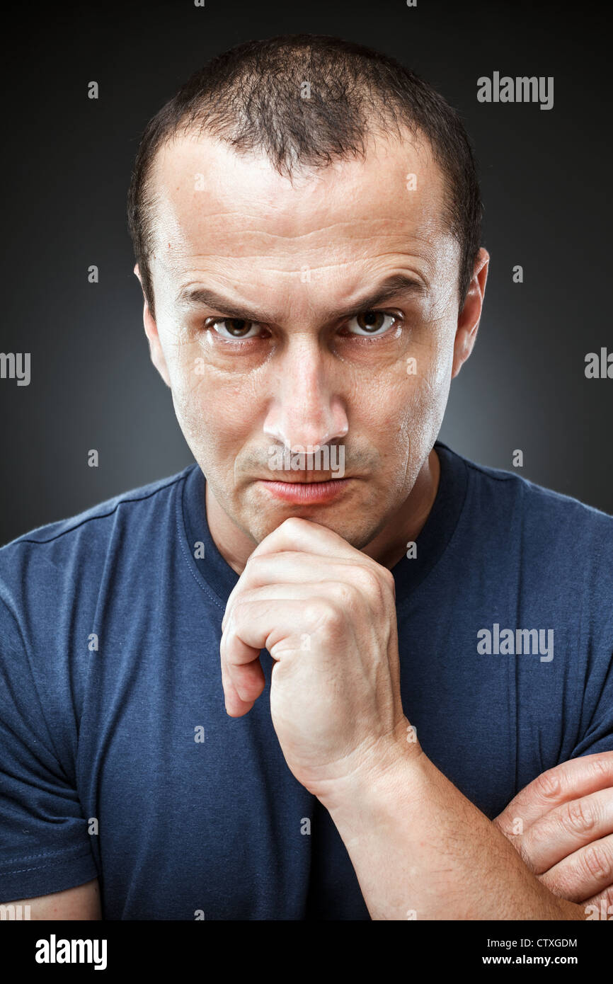 Inquisitive man expression, studio shot Stock Photo - Alamy