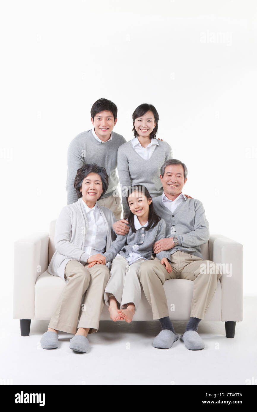 A large family around the couch Stock Photo - Alamy