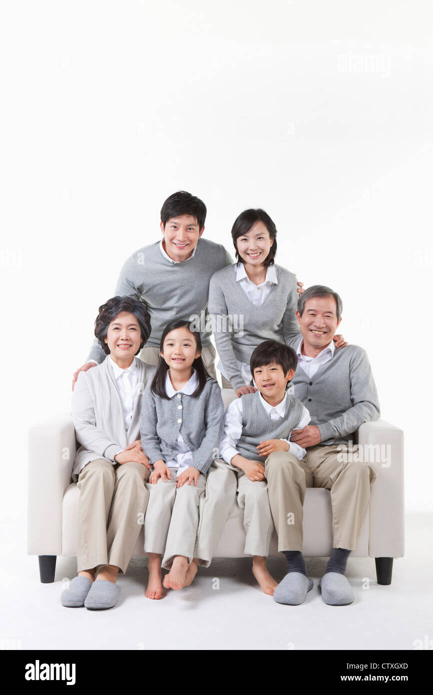 A large family around the couch Stock Photo - Alamy
