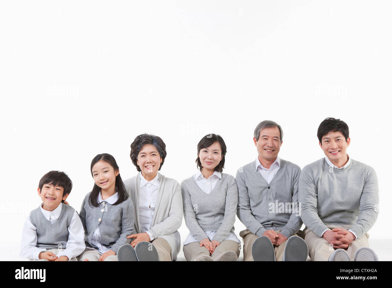 A large family sitting together Stock Photo - Alamy