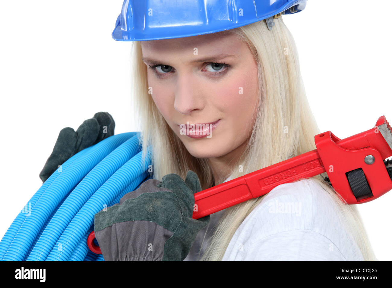 Female construction carrying pipes hi-res stock photography and images ...