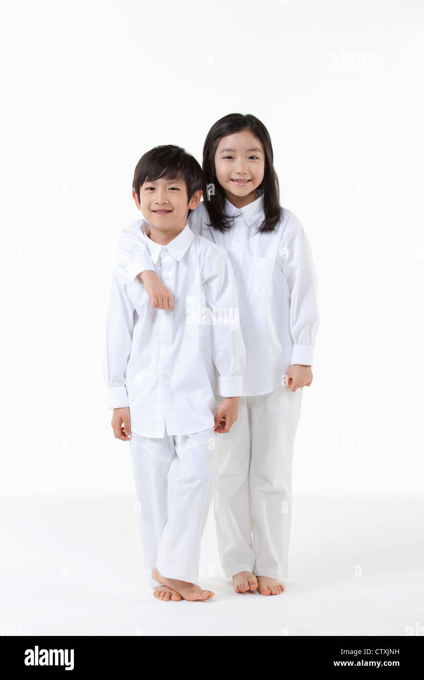 A boy and girl putting arms around on Stock Photo - Alamy