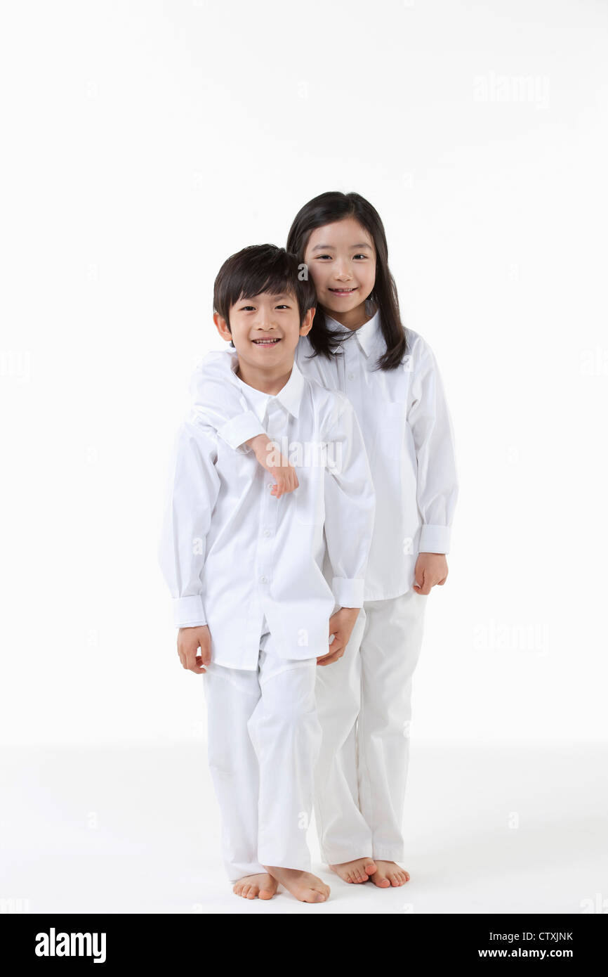 A boy and girl putting arms around on Stock Photo - Alamy