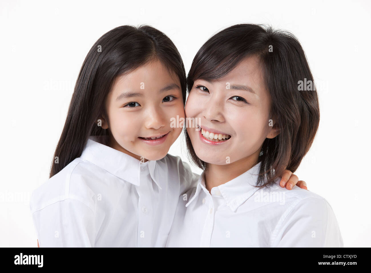 Smiling mother and daughter Stock Photo - Alamy