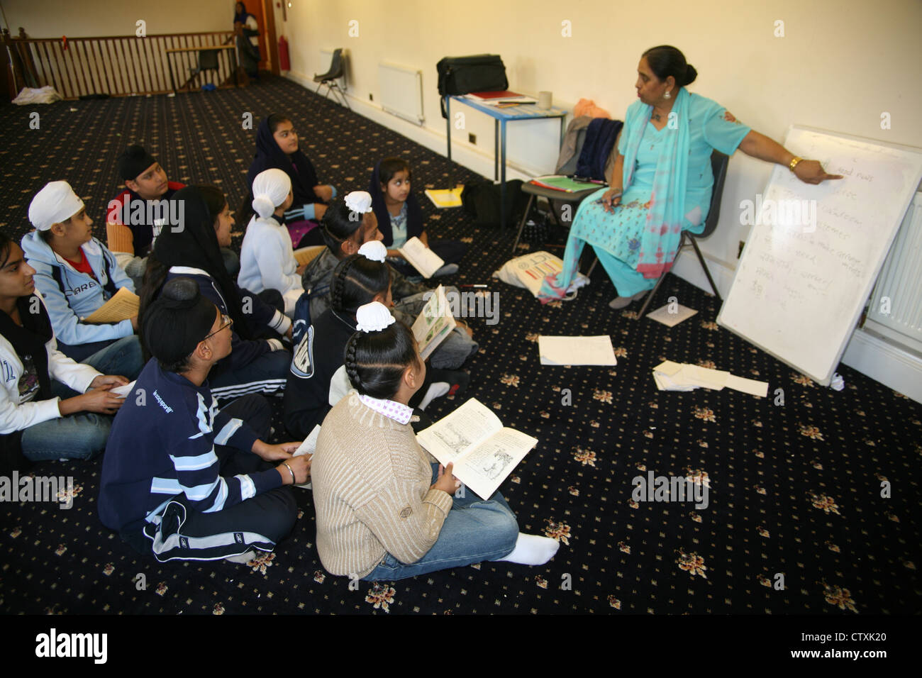 Sunday school class for Sikh children in a London gurdwara Stock Photo ...