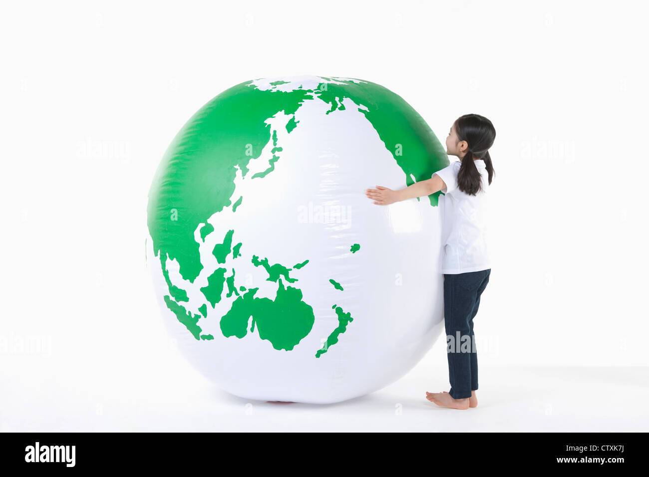 Girl hugging globe Cut Out Stock Images & Pictures - Alamy