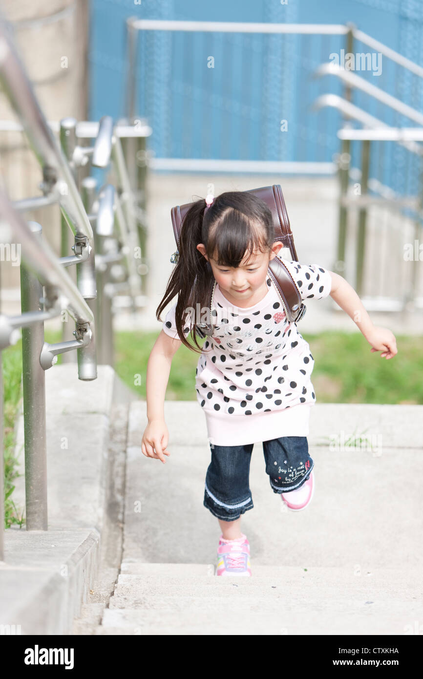 A girl walking up stairs Stock Photo - Alamy