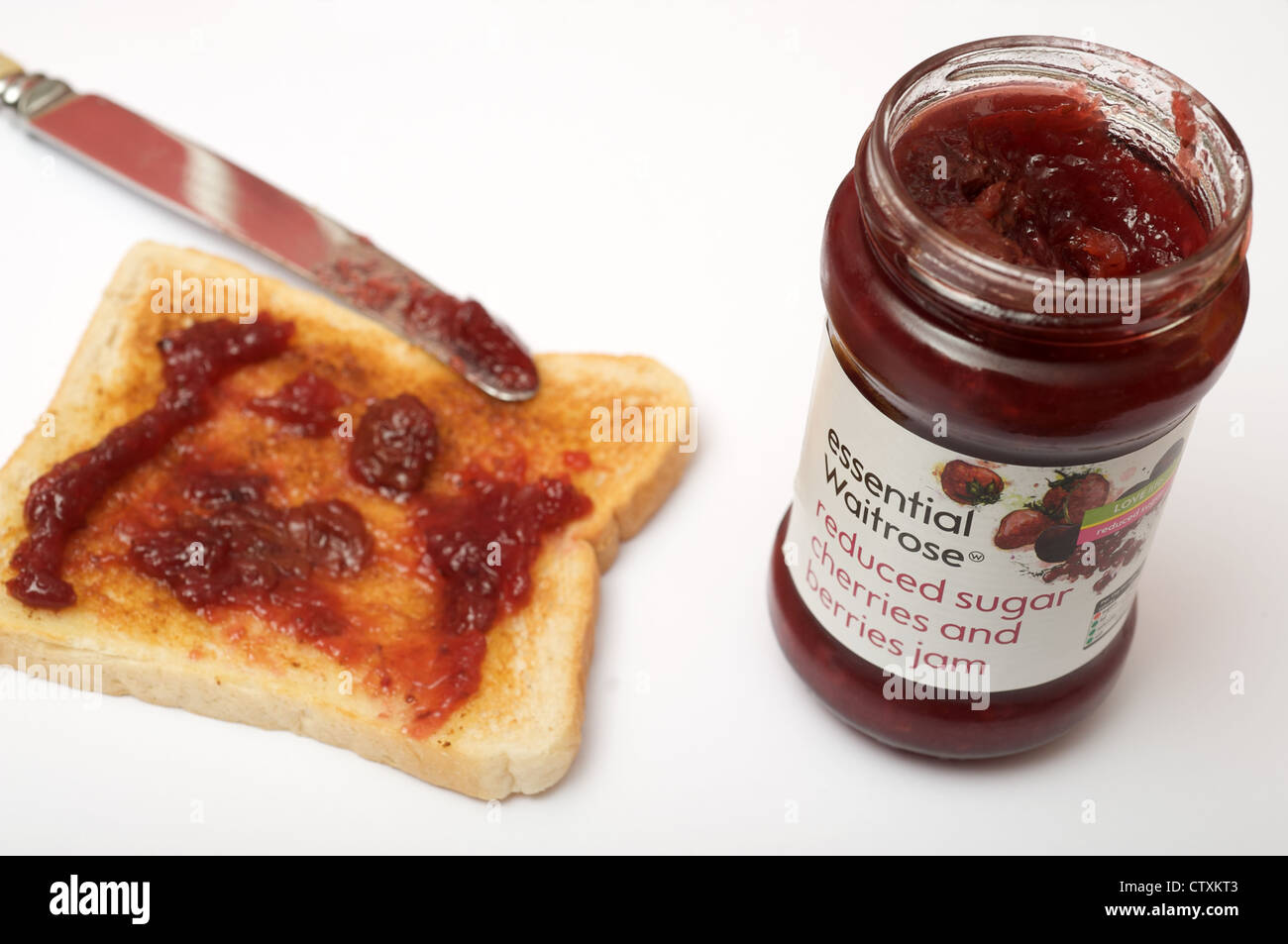 Essential Waitrose reduced sugar cherries and berries jam and toast ...