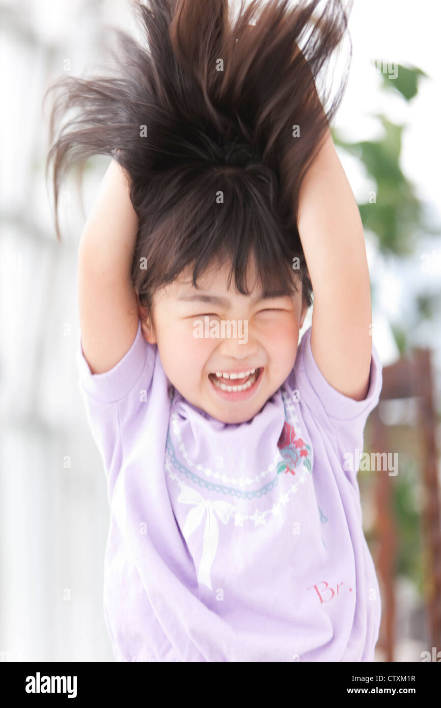 A girl playing Stock Photo - Alamy