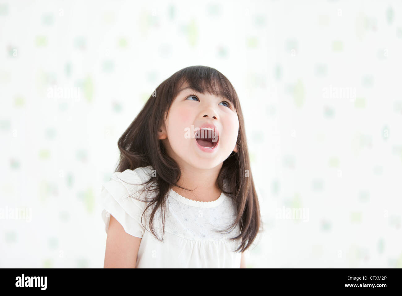 Smiling girl opening mouth hi-res stock photography and images - Alamy
