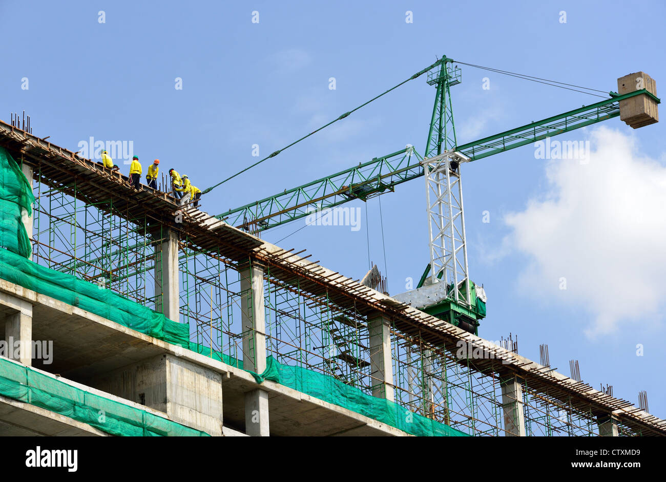 Group of the workers are working on high constructionsite Stock Photo ...