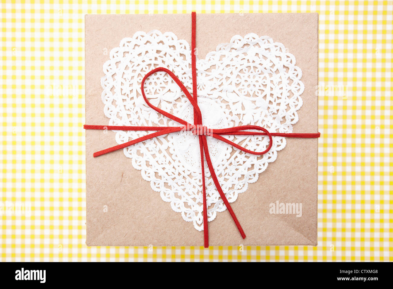 Heart lace gift box with red ribbon Stock Photo - Alamy