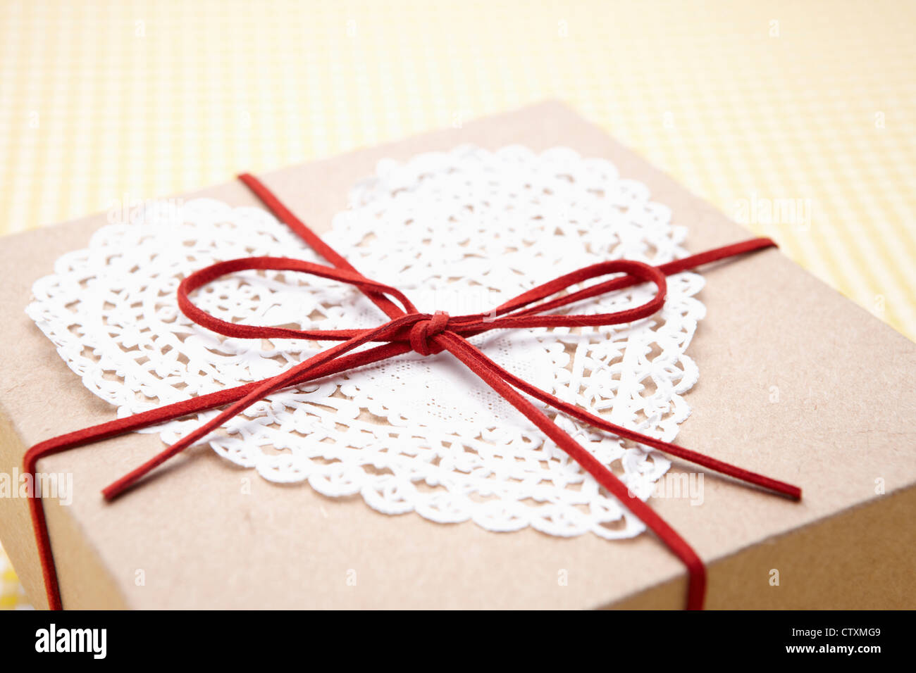 Heart lace gift box with red ribbon Stock Photo - Alamy