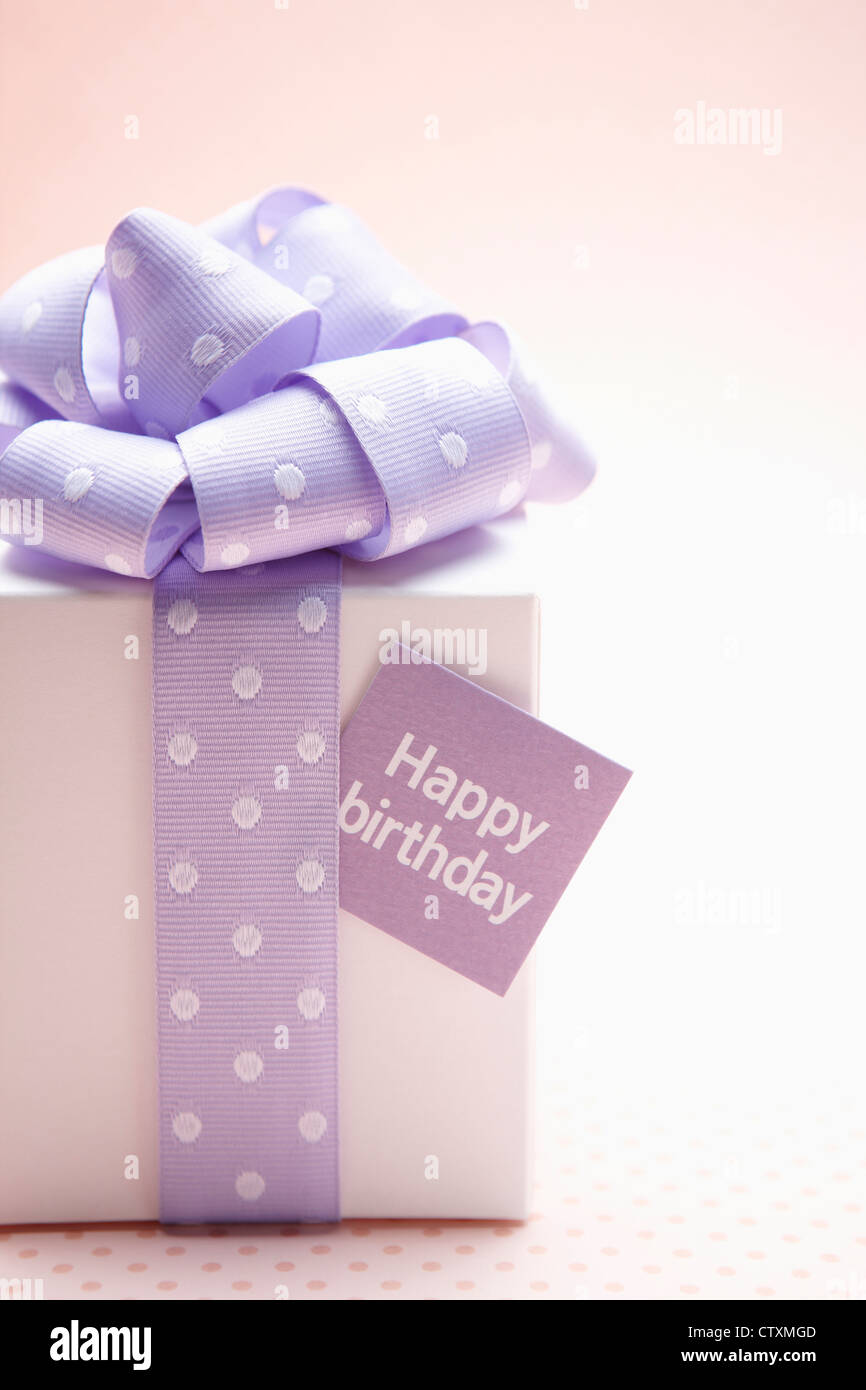 Purple ribbon gift box and birthday card Stock Photo - Alamy
