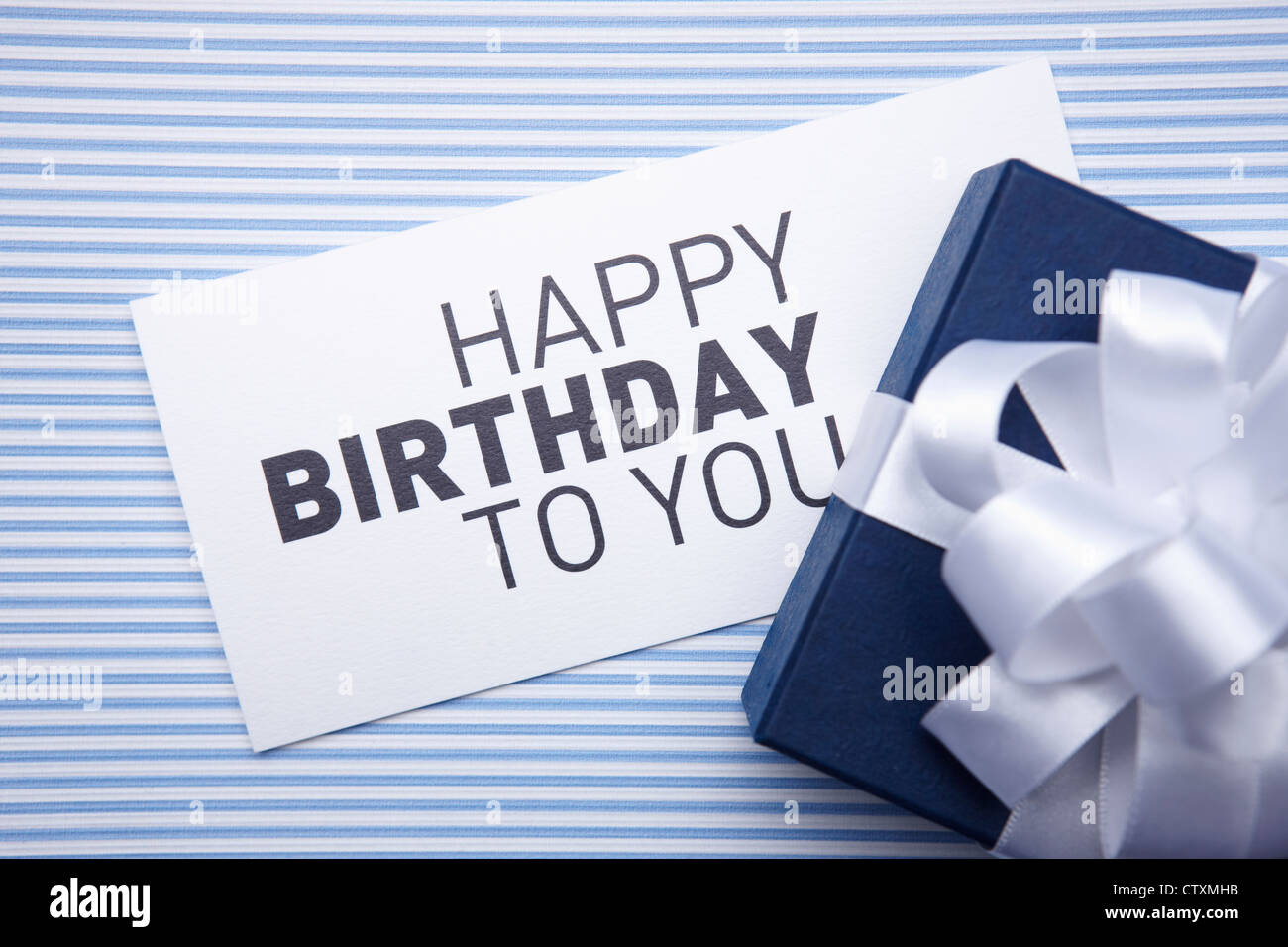 Blue gift box and birthday card Stock Photo - Alamy