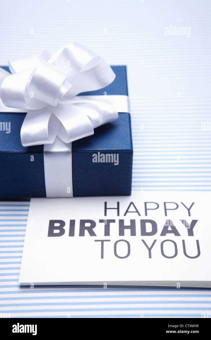 Blue gift box and birthday card Stock Photo - Alamy