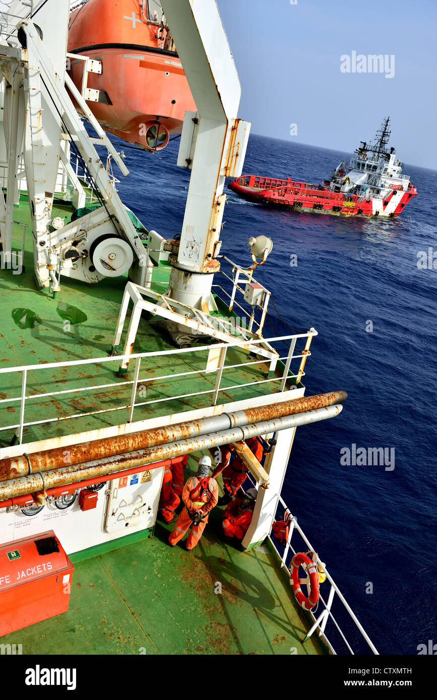 Group of the workers are waiting at oil rig for supply boat Stock Photo ...