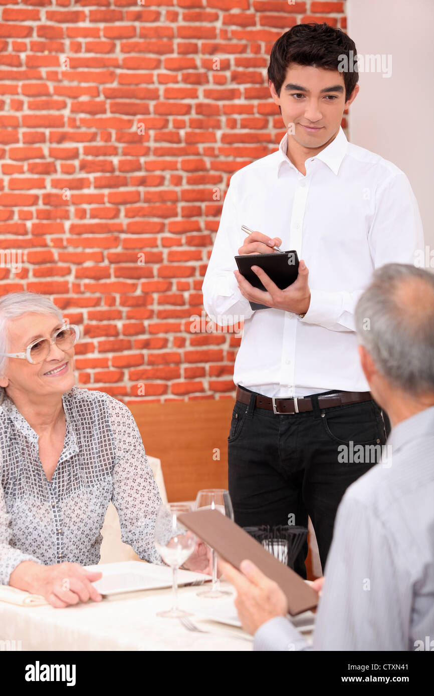 Taking an order Stock Photo - Alamy