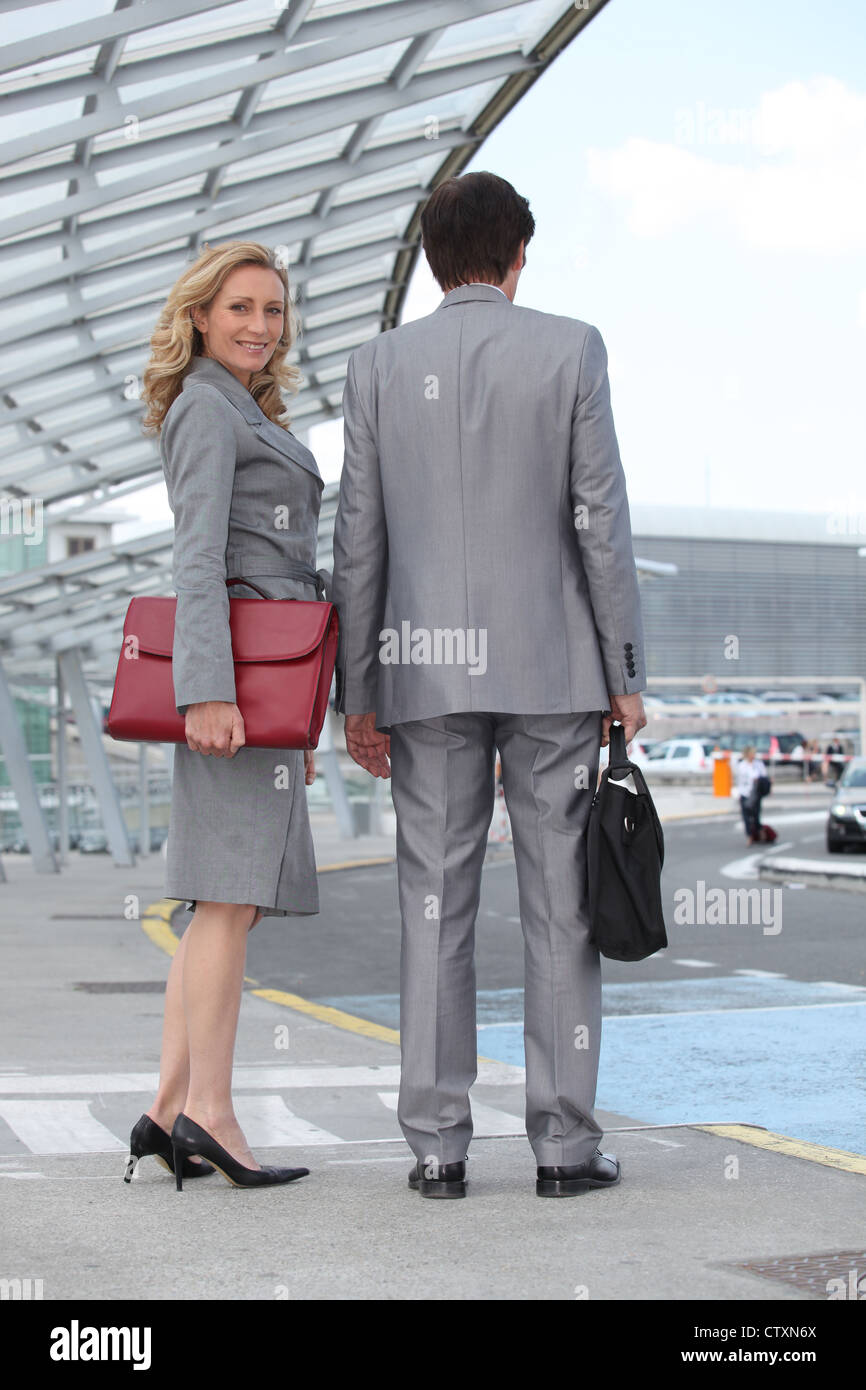 Blonde woman waiting taxi hi-res stock photography and images - Alamy