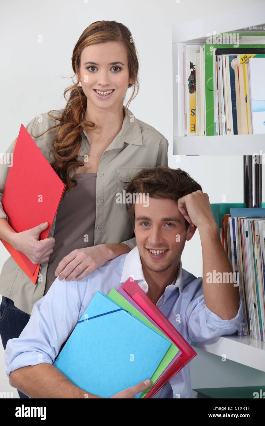 Two university students in the library Stock Photo - Alamy