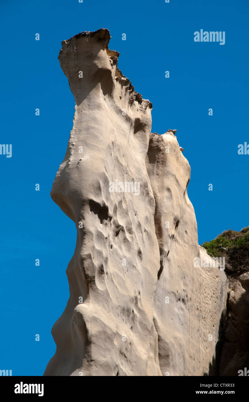Sea-carved sandstone clilffs, rock arches and caves form Tunnel Beach ...
