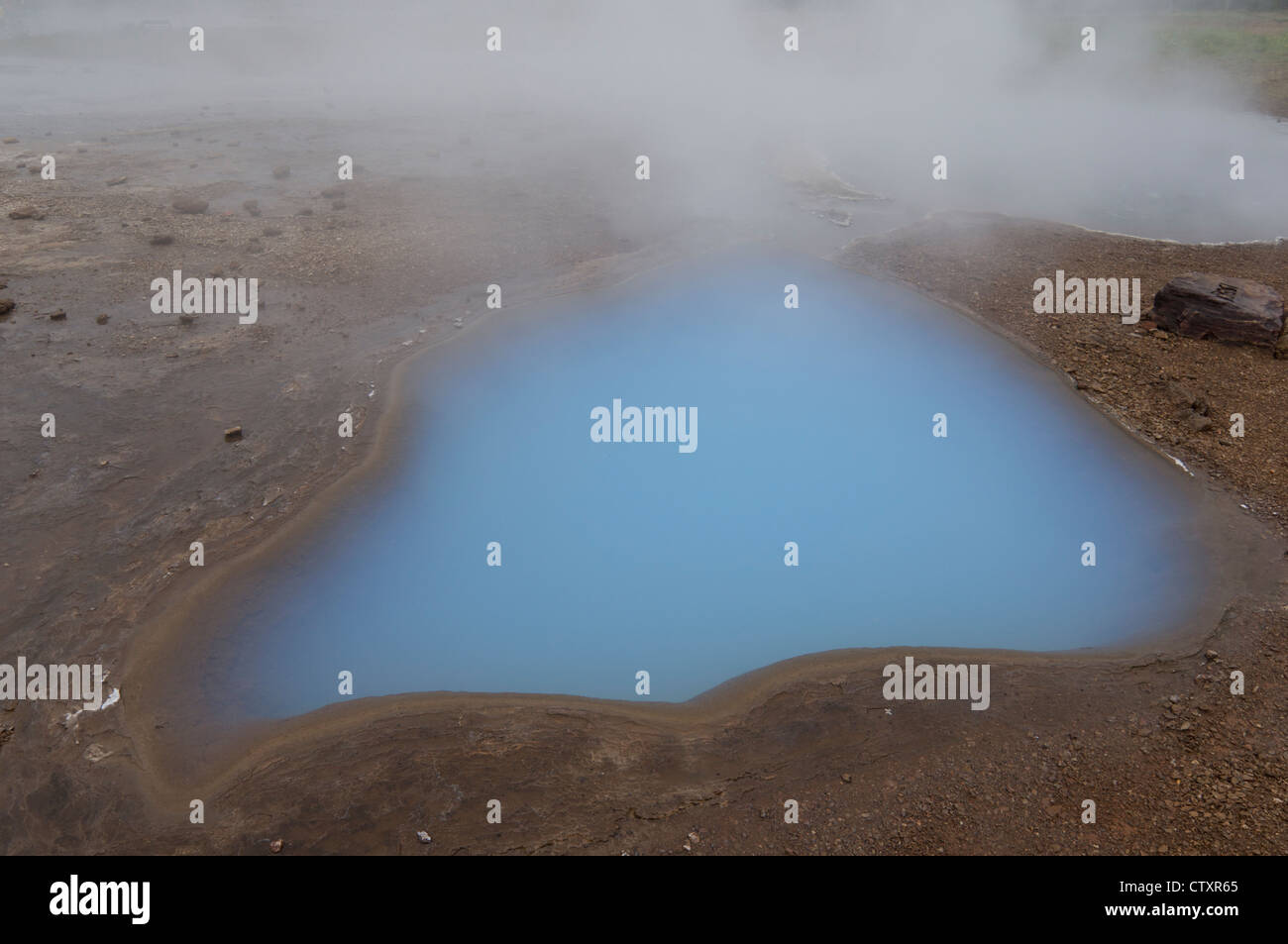 Hot Spring with Water Vapor in Iceland Stock Photo - Alamy