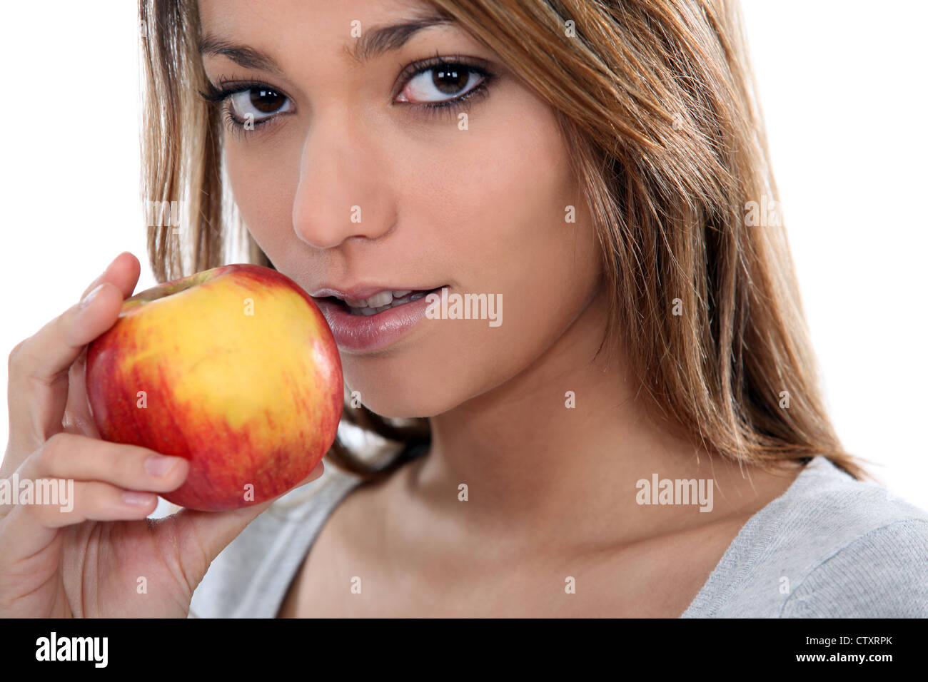 young sensual woman is going to eat an apple Stock Photo - Alamy