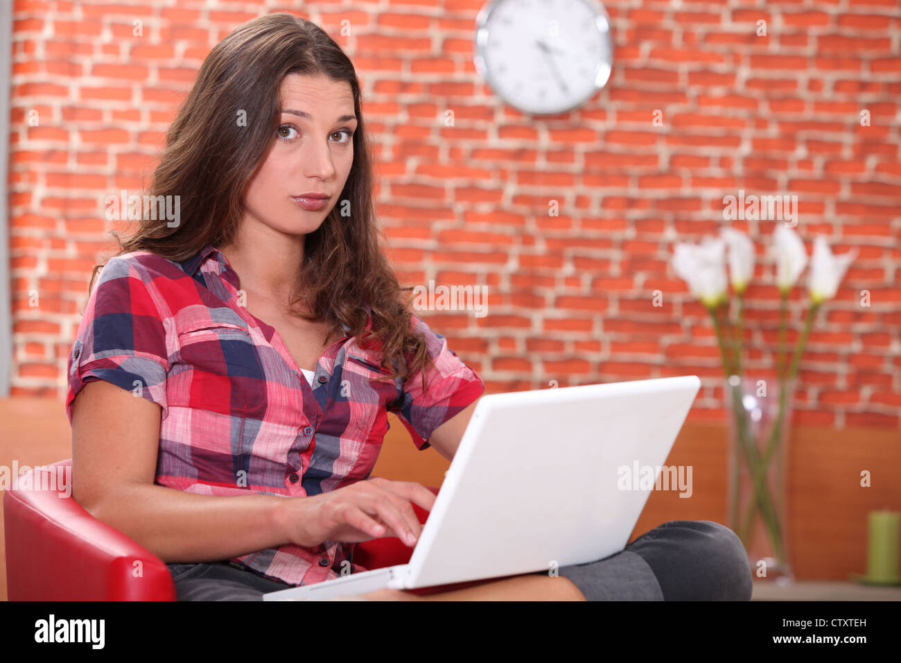 woman sitting with computer Stock Photo - Alamy