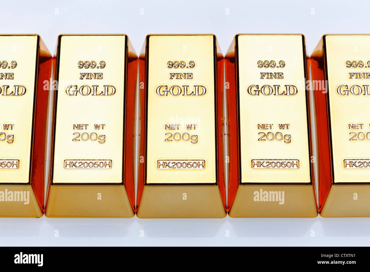 Gold bars in a line Stock Photo - Alamy