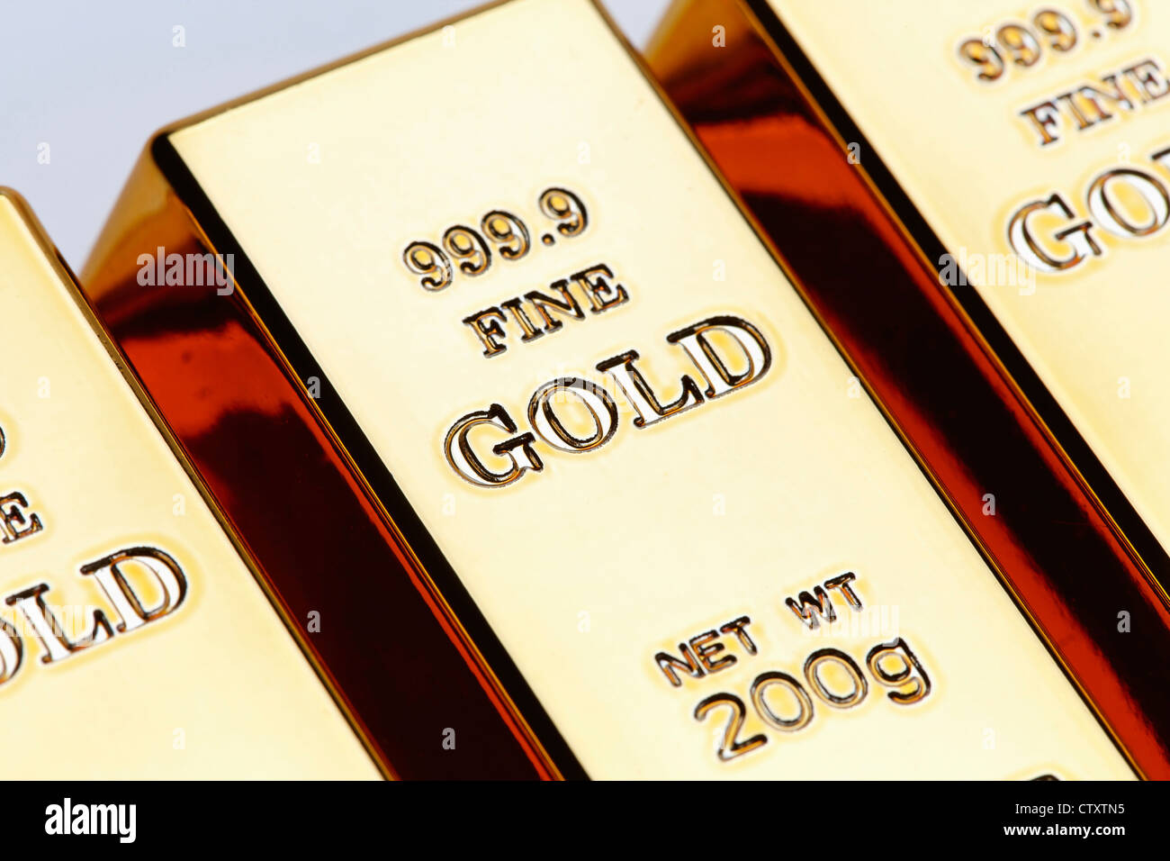 Gold bars in a line Stock Photo - Alamy