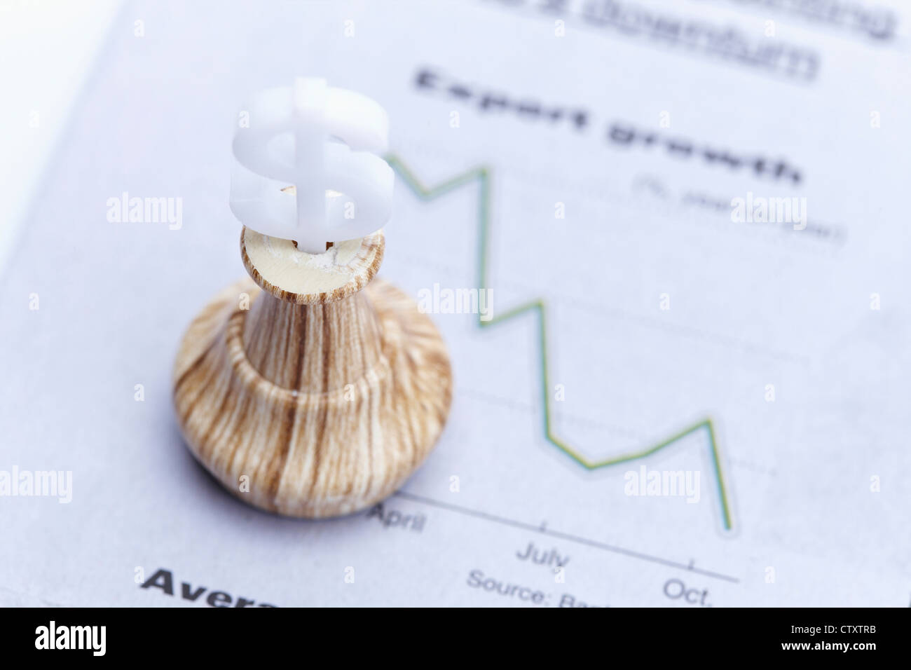 Dollar chess piece on the chart Stock Photo - Alamy