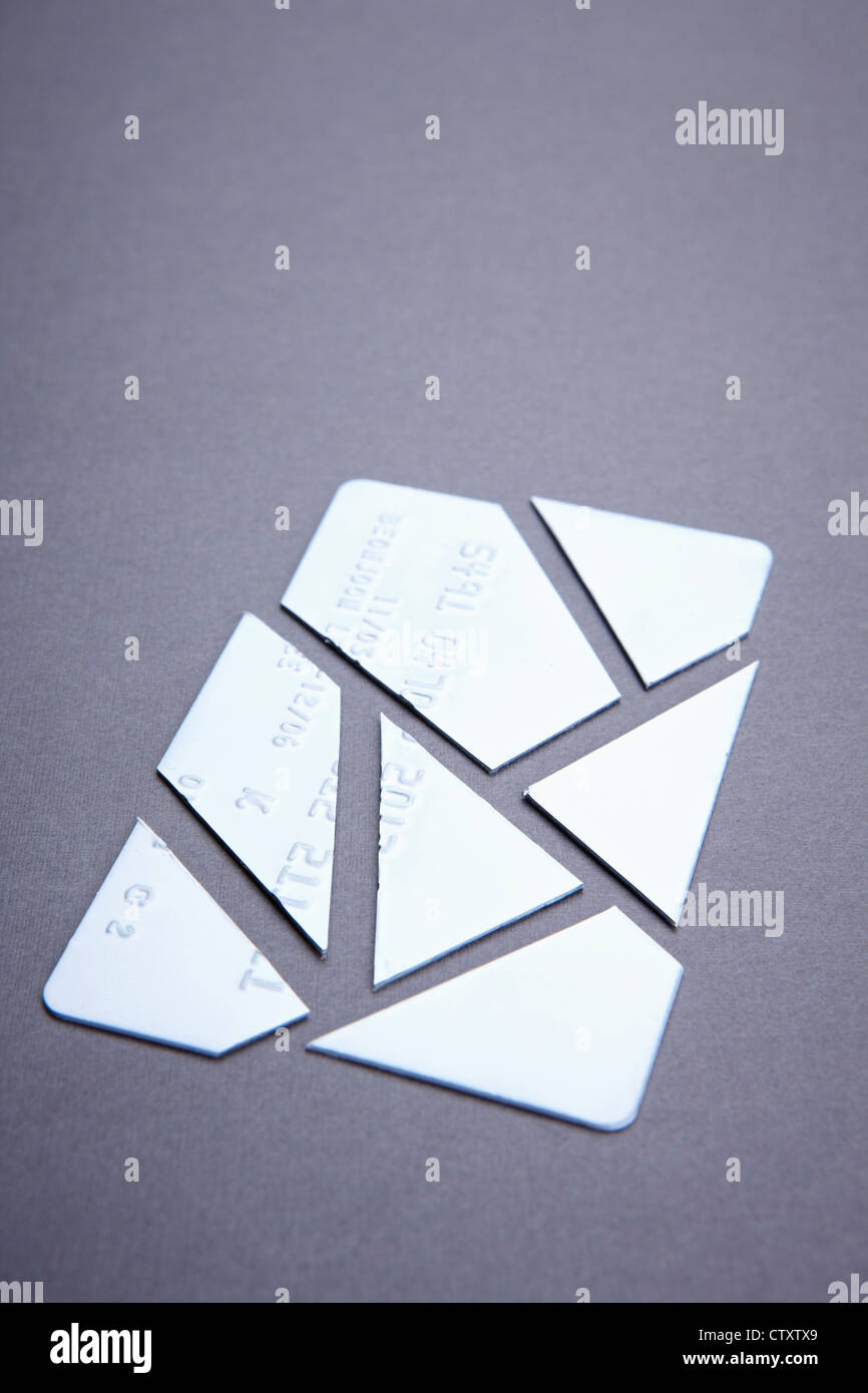 Credit card cut in pieces Stock Photo - Alamy