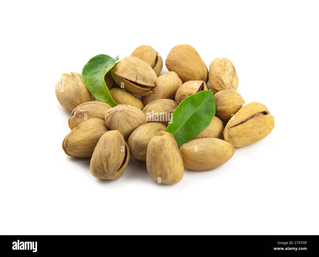 pistachios and green leaf isolated on white Stock Photo - Alamy