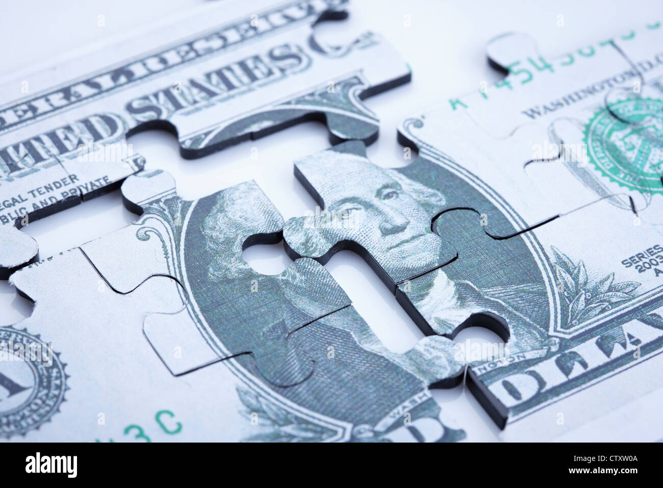 Dollar pieces of puzzle Stock Photo - Alamy