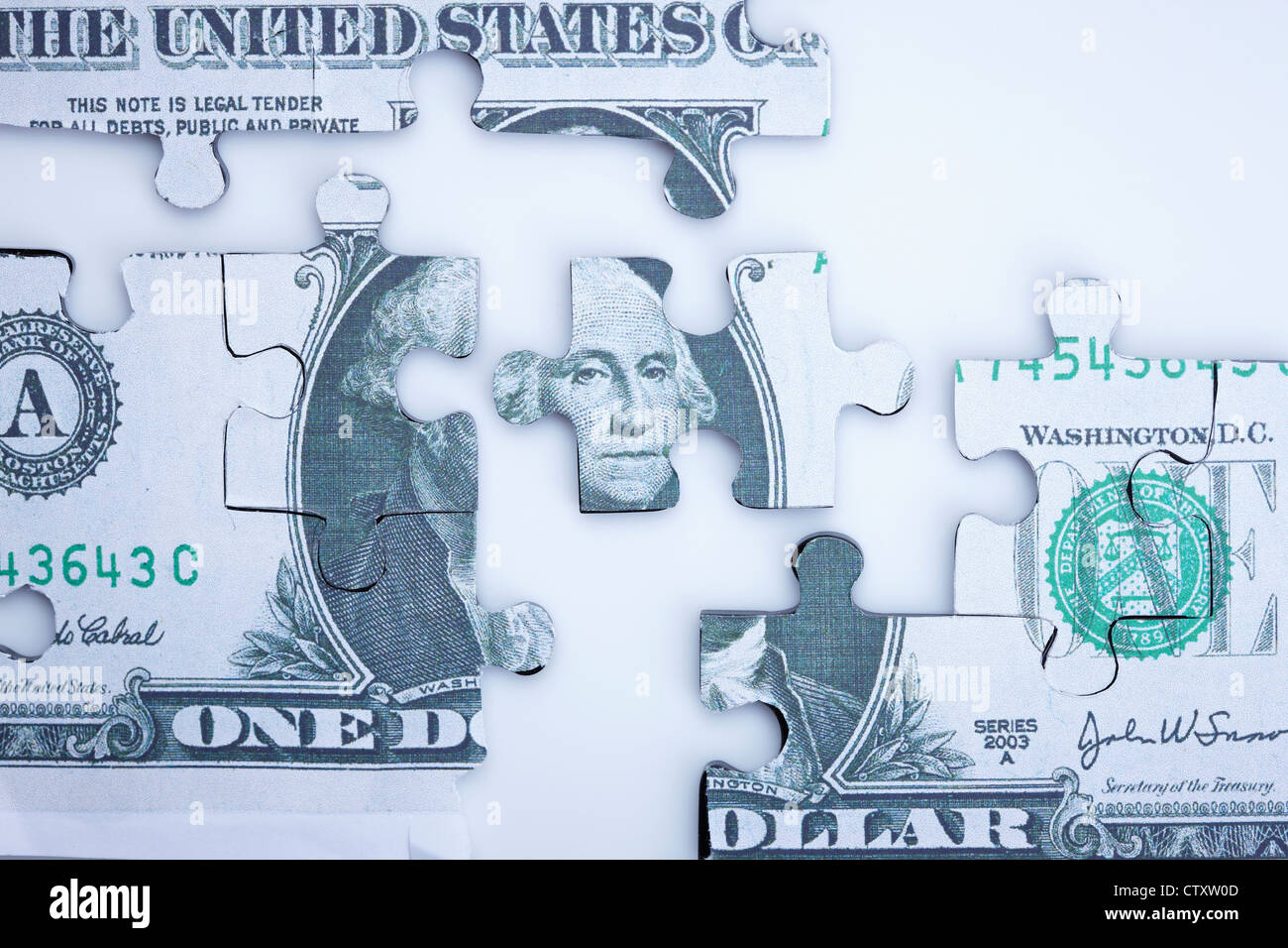 Dollar pieces of puzzle Stock Photo - Alamy