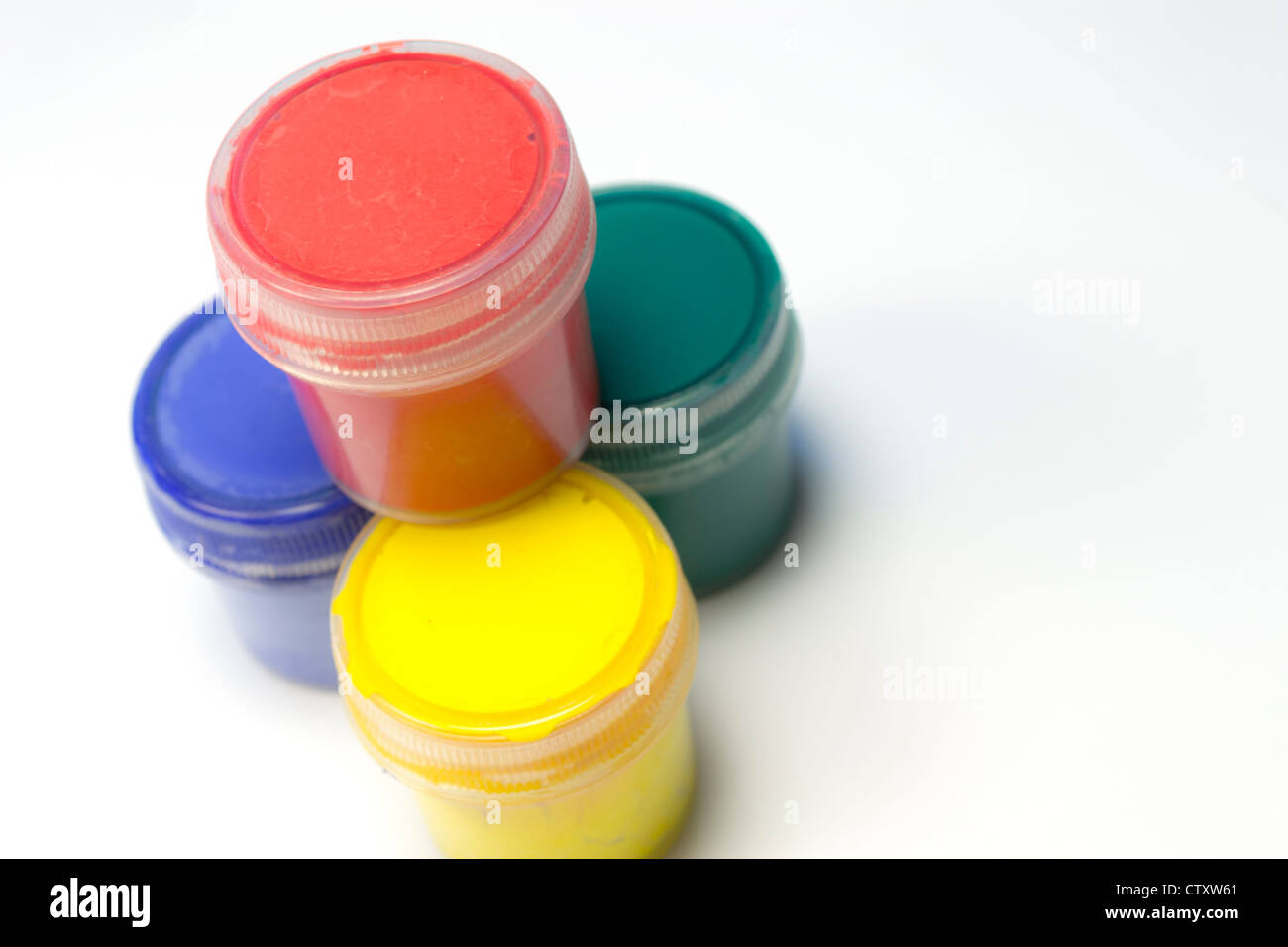 barrels of paint on a white background Stock Photo - Alamy