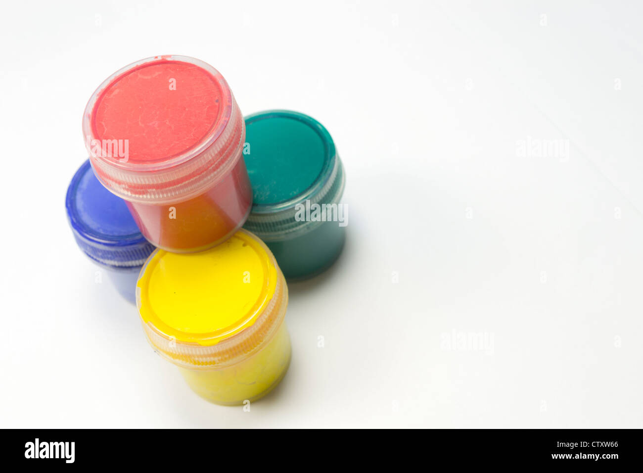barrels of paint on a white background Stock Photo - Alamy