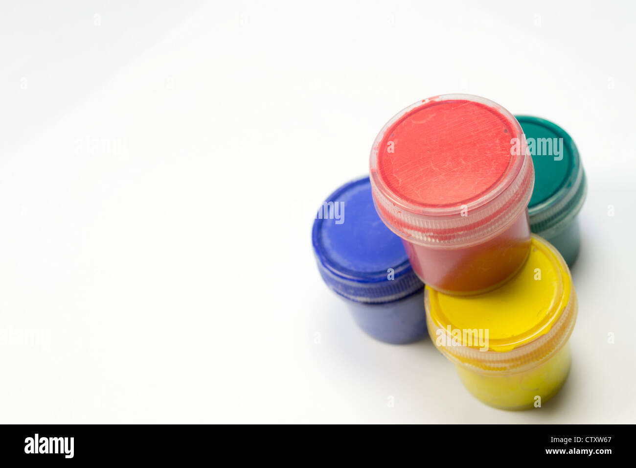 barrels of paint on a white background Stock Photo - Alamy