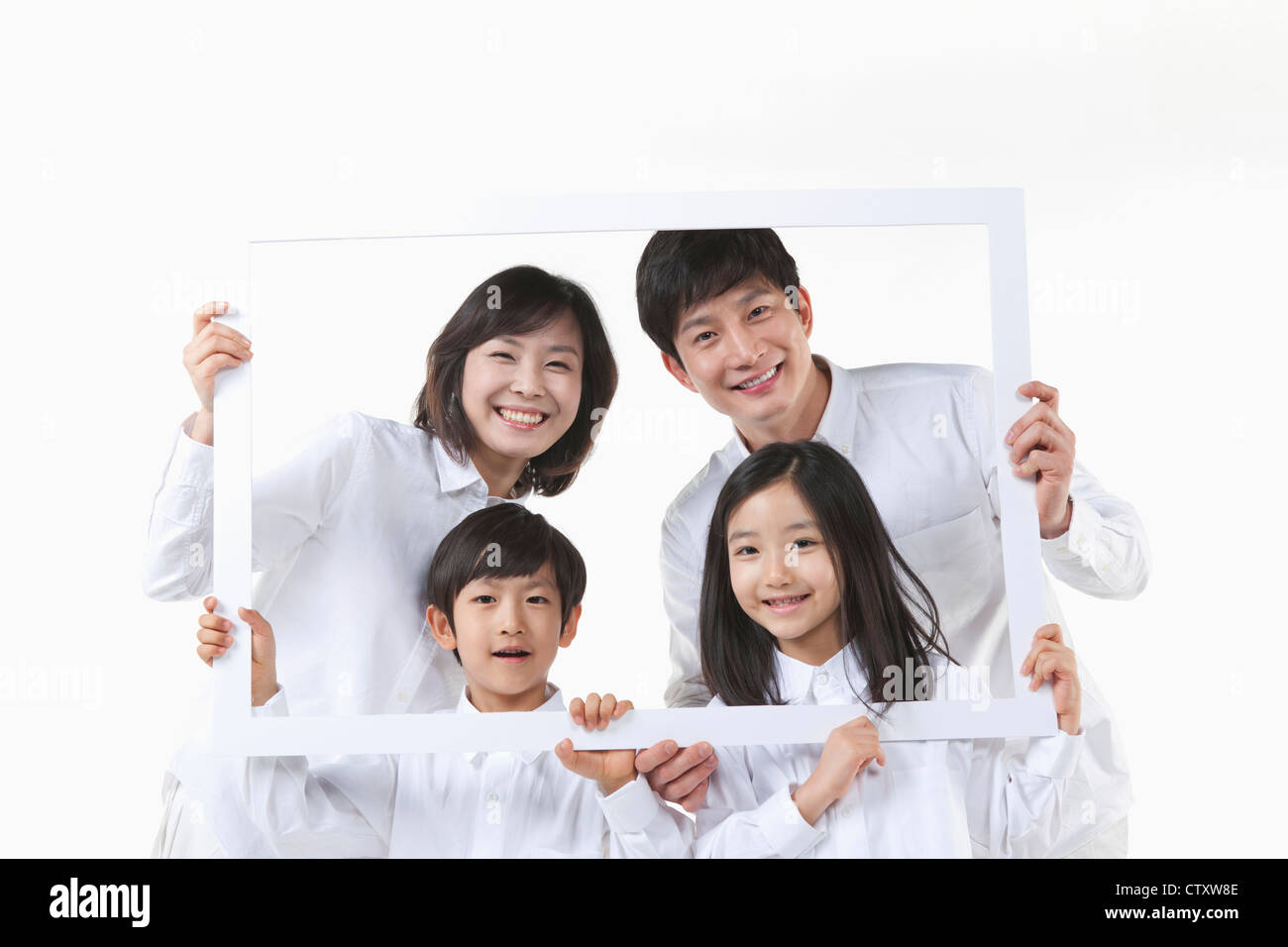 A family in the white frame Stock Photo - Alamy