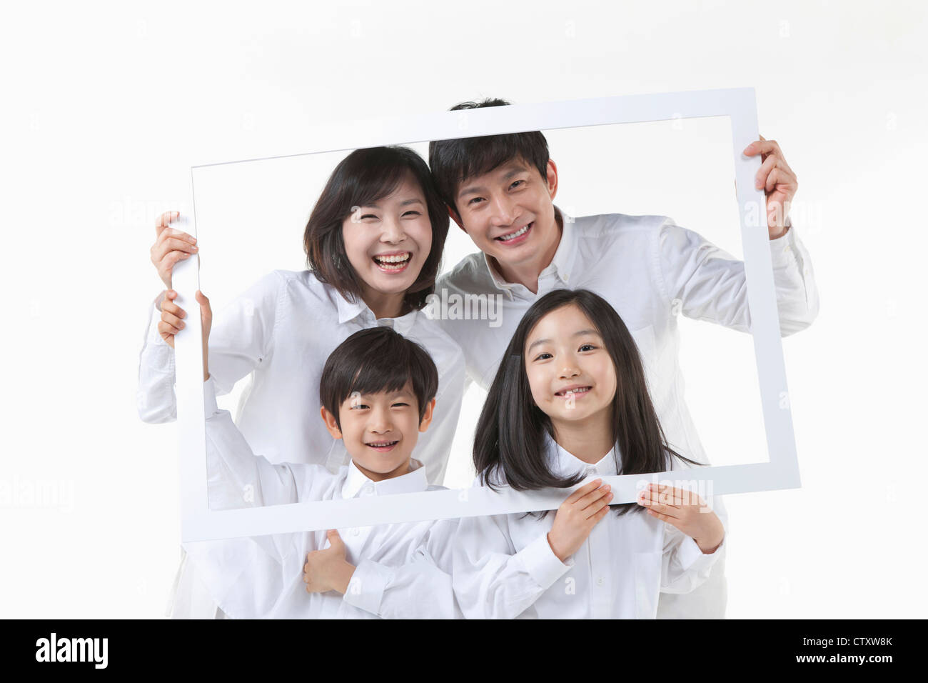 A family in the white frame Stock Photo - Alamy