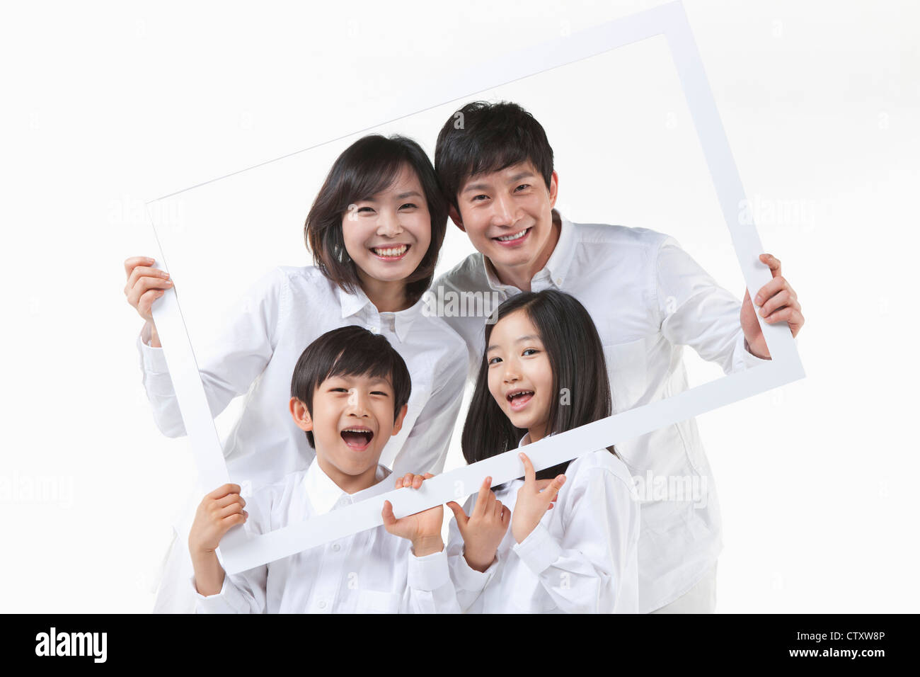 A family in the white frame Stock Photo - Alamy
