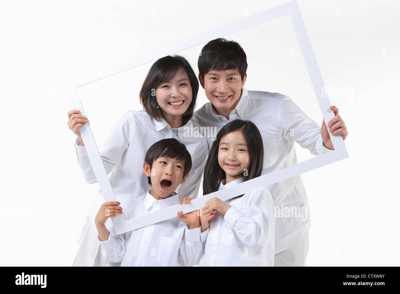 A family in the white frame Stock Photo - Alamy