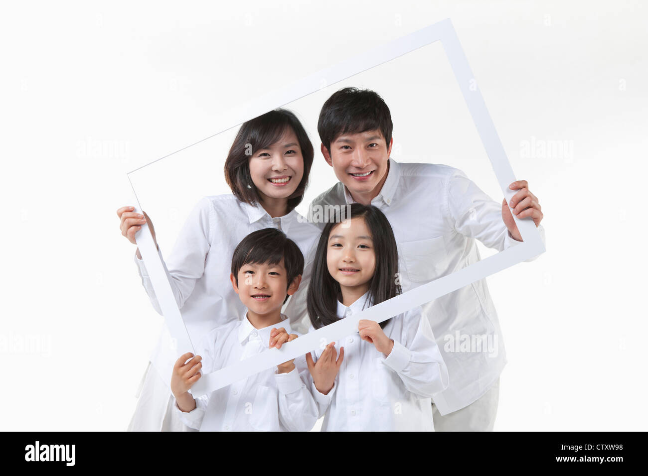 A family in the white frame Stock Photo - Alamy