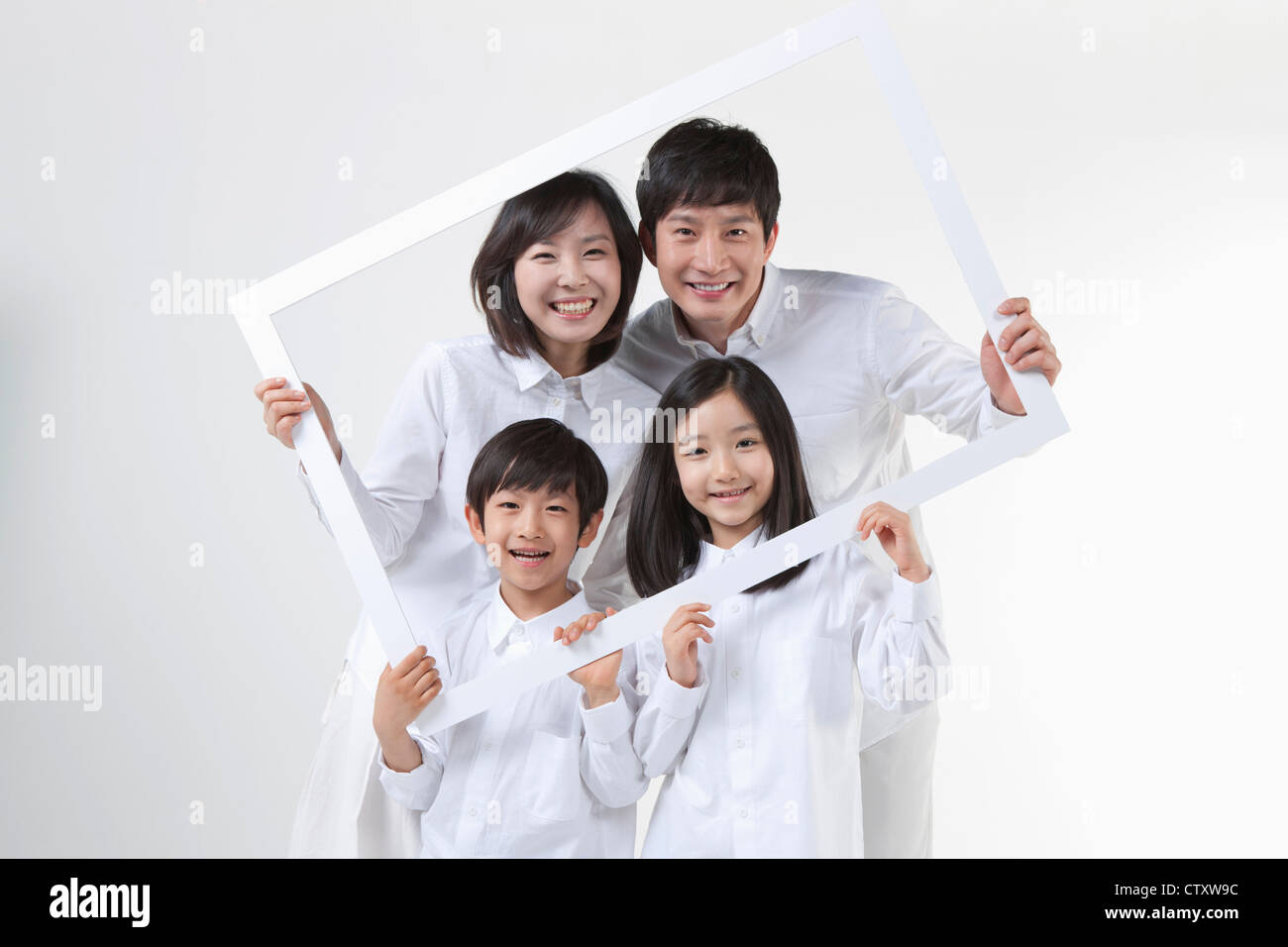 A family in the white frame Stock Photo - Alamy