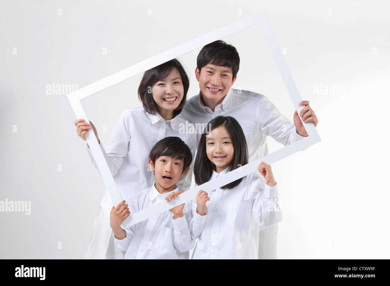 A family in the white frame Stock Photo - Alamy