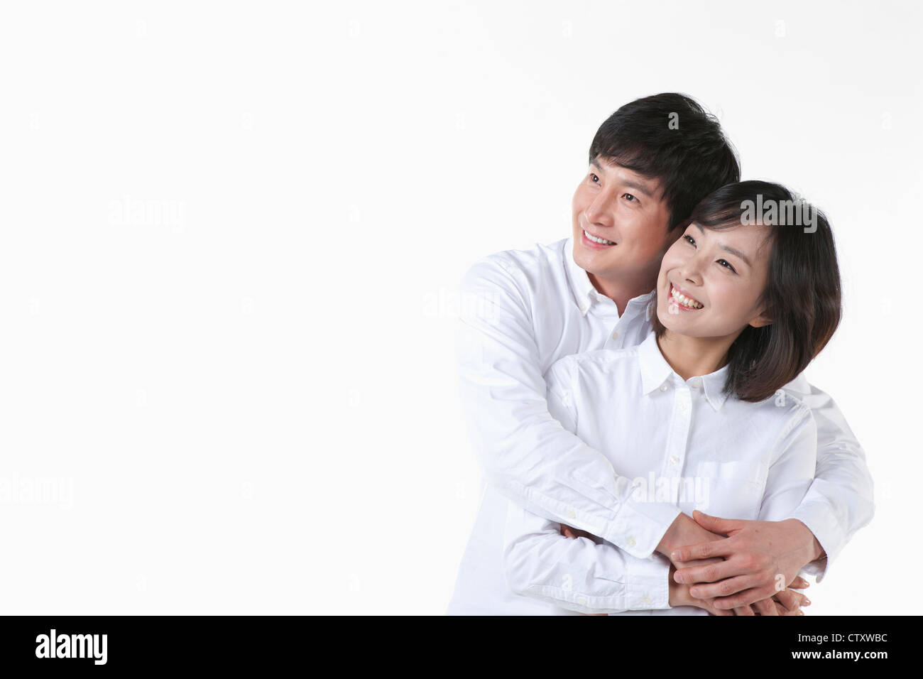 A couple hugging together Stock Photo - Alamy