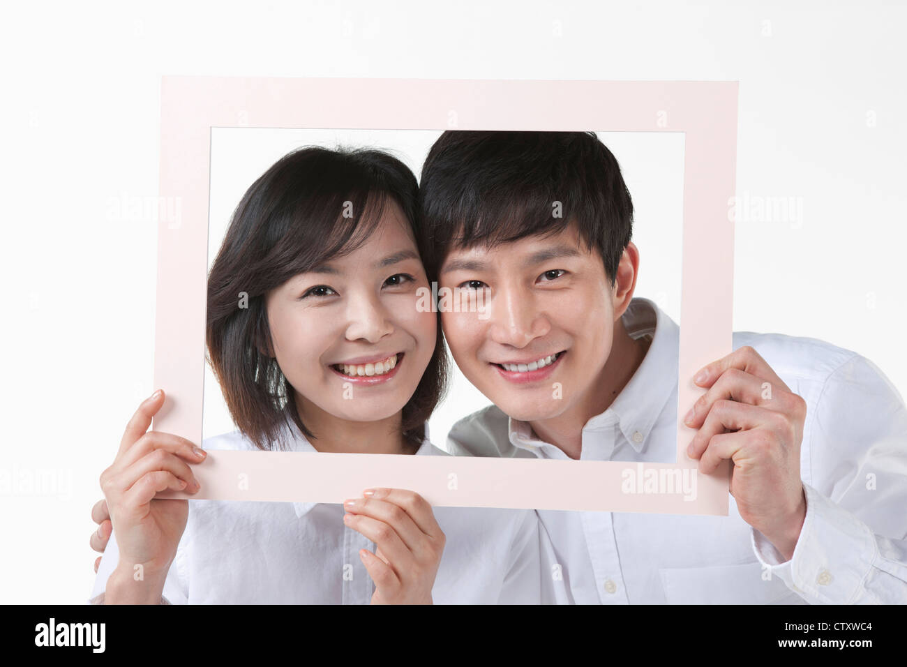 A couple in pink frame Stock Photo - Alamy