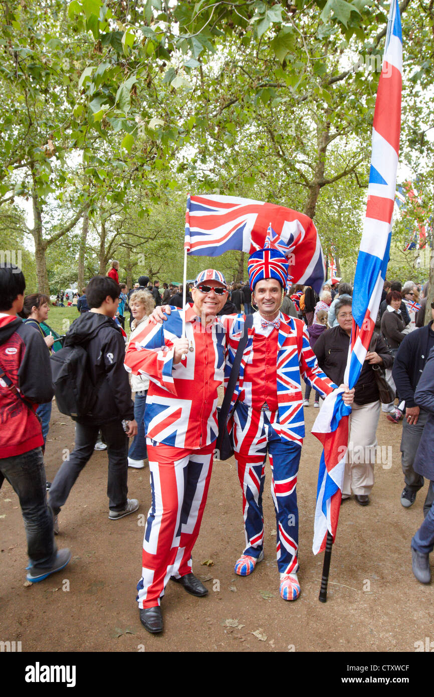 Spectators line the route of the royal carriage procession through ...