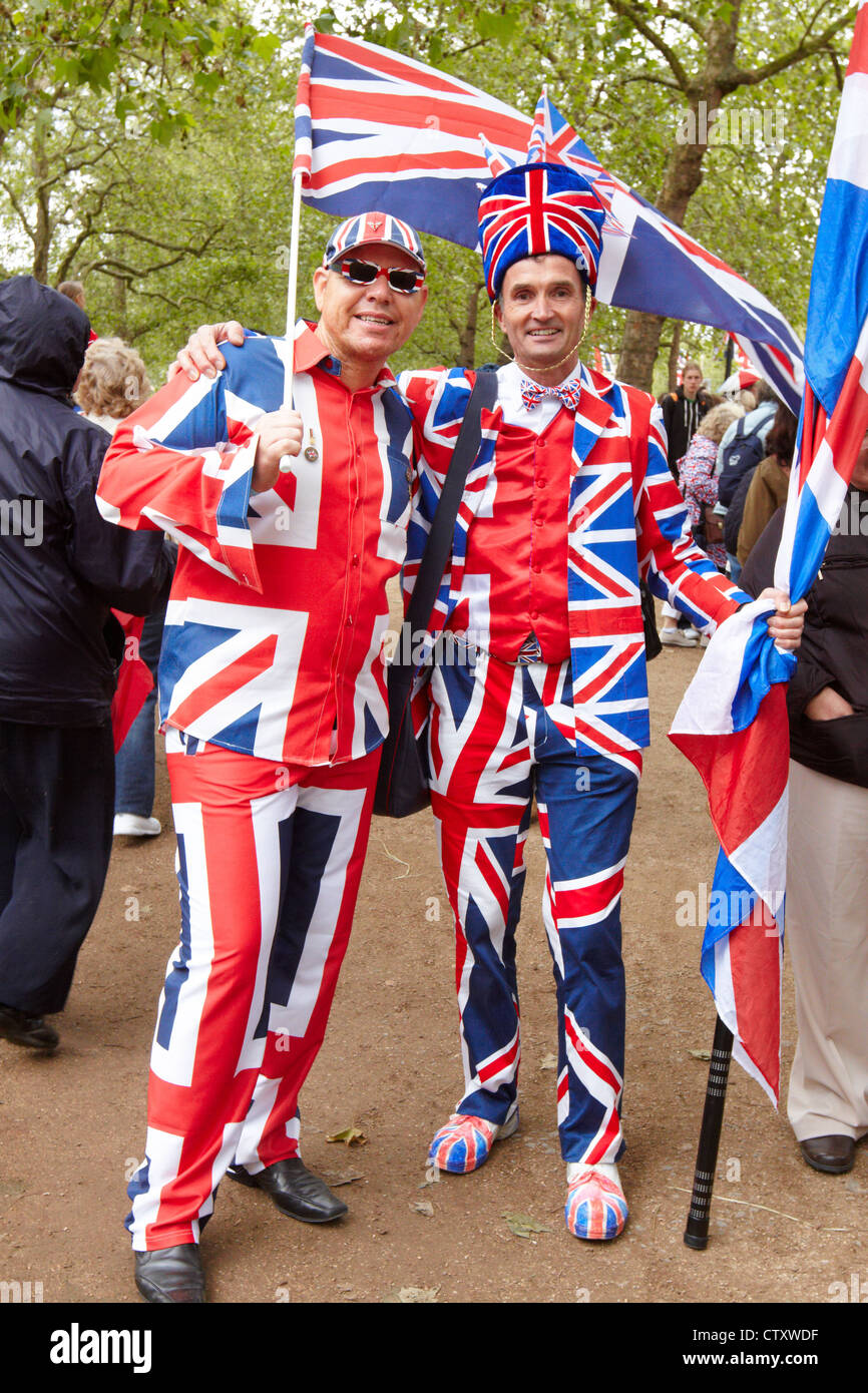 Spectators line the route of the royal carriage procession through ...