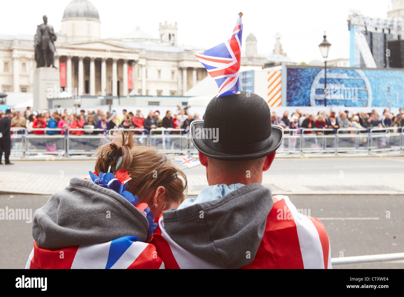 Spectators line the route of the royal carriage procession through ...